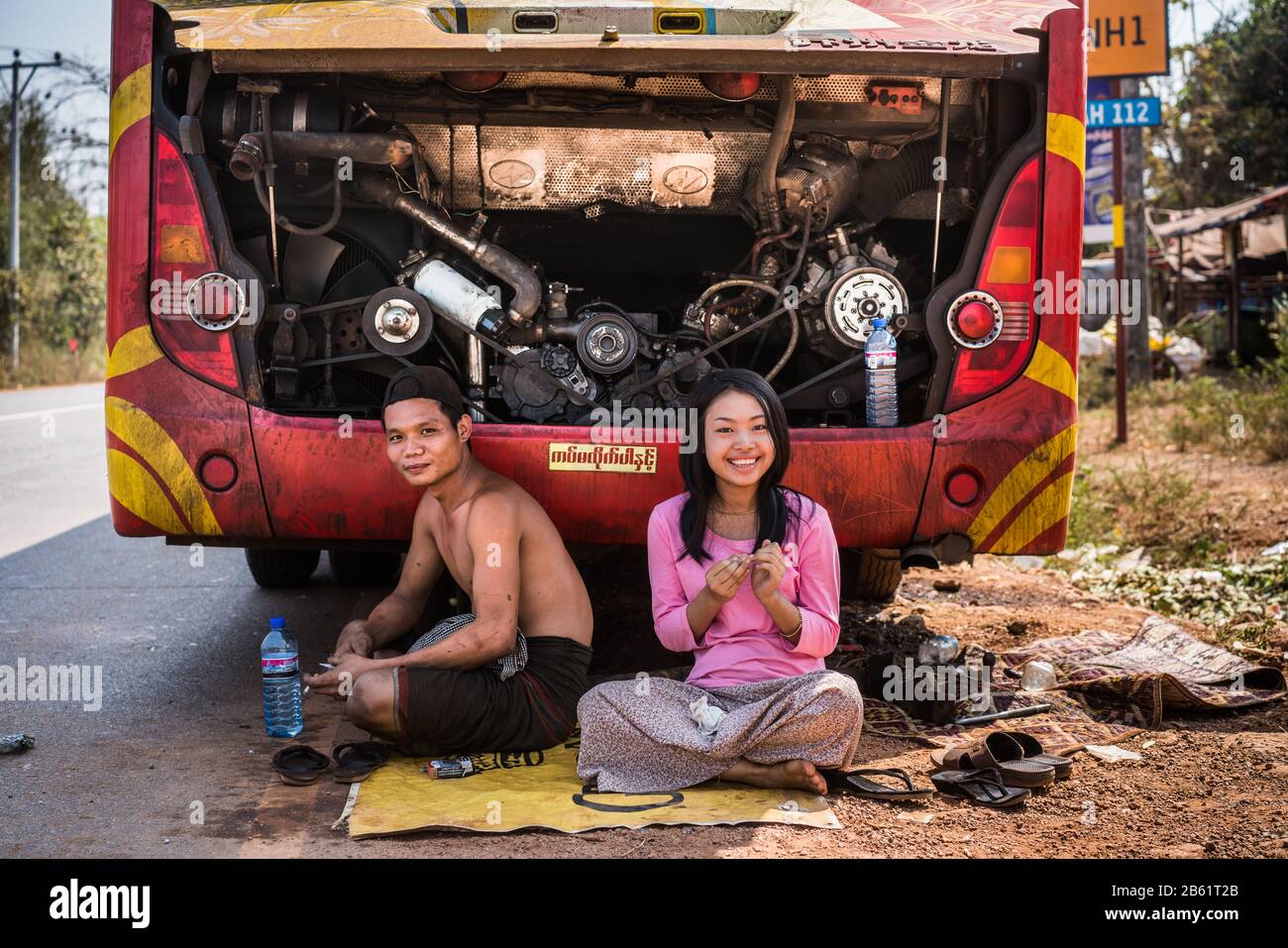Repair of the broken bus on the road, Myanmar, Asia Stock Photo - Alamy