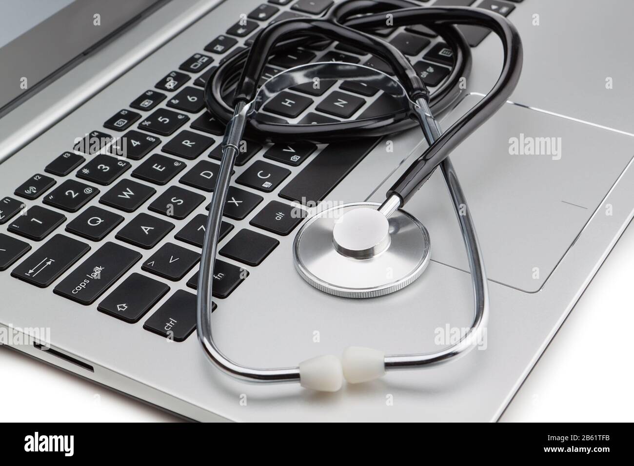 Medical stethoscope on a modern laptop, close-up. Isolated Stock Photo ...