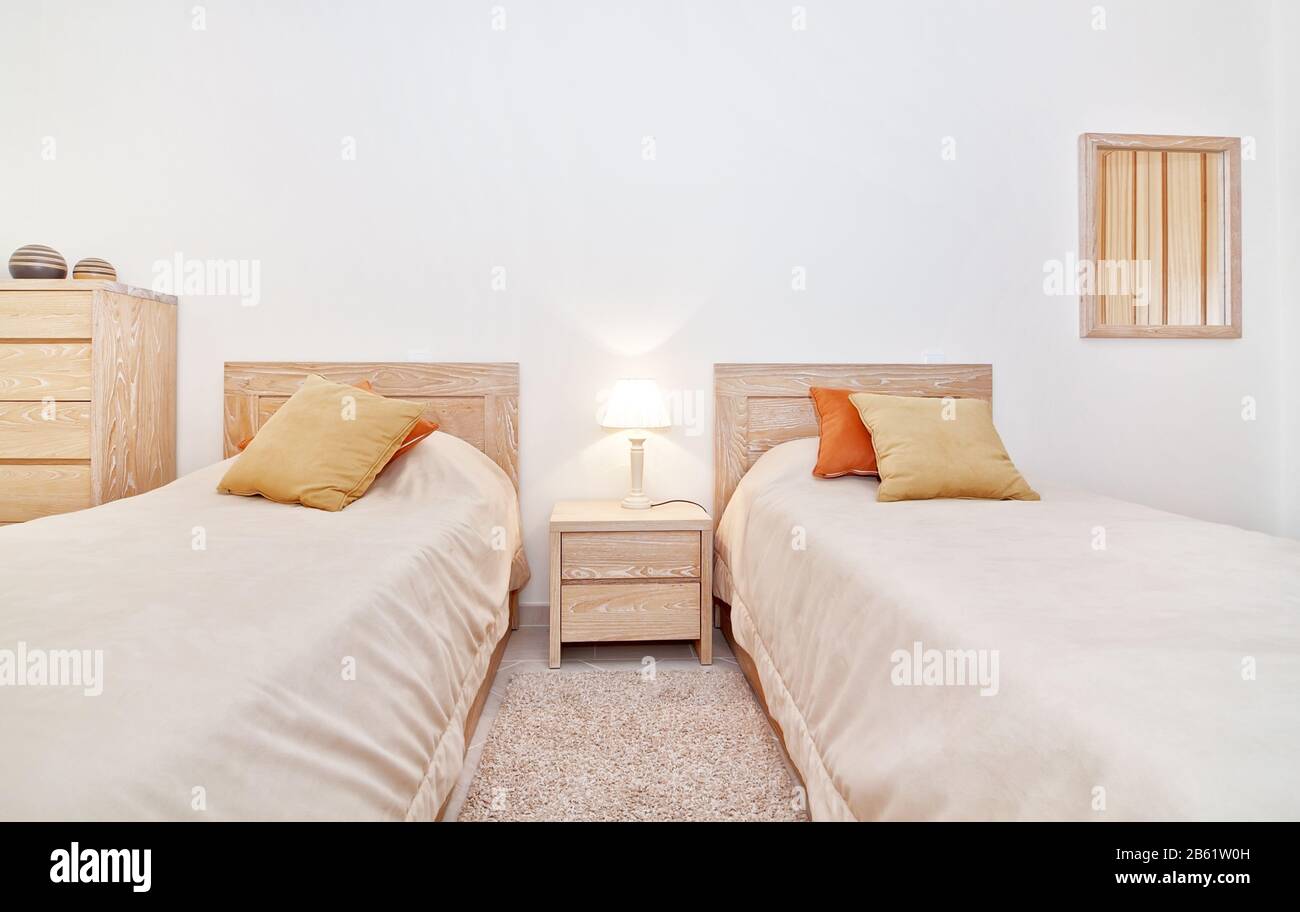 Modern bedroom for a family. Front view Stock Photo - Alamy