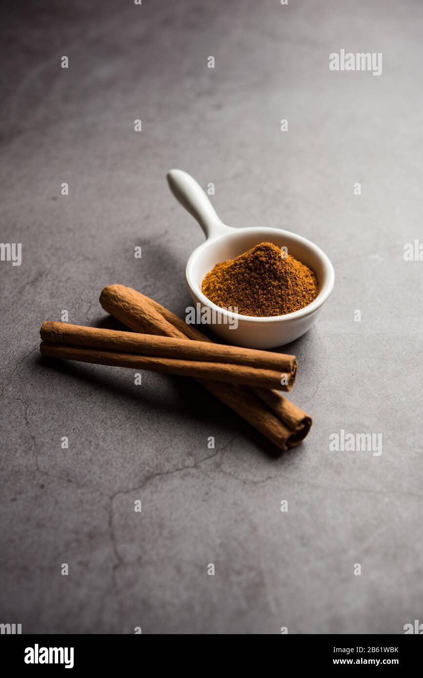 Powder cinnamon and sticks also known as Dalchini or Dalcheenee masala ...