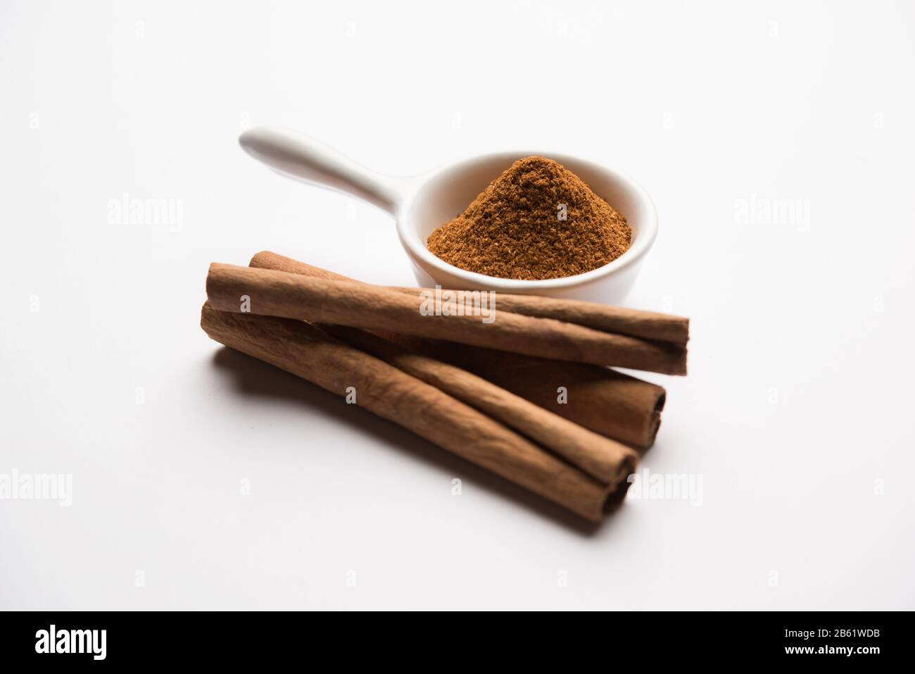 Powder cinnamon and sticks also known as Dalchini or Dalcheenee masala ...