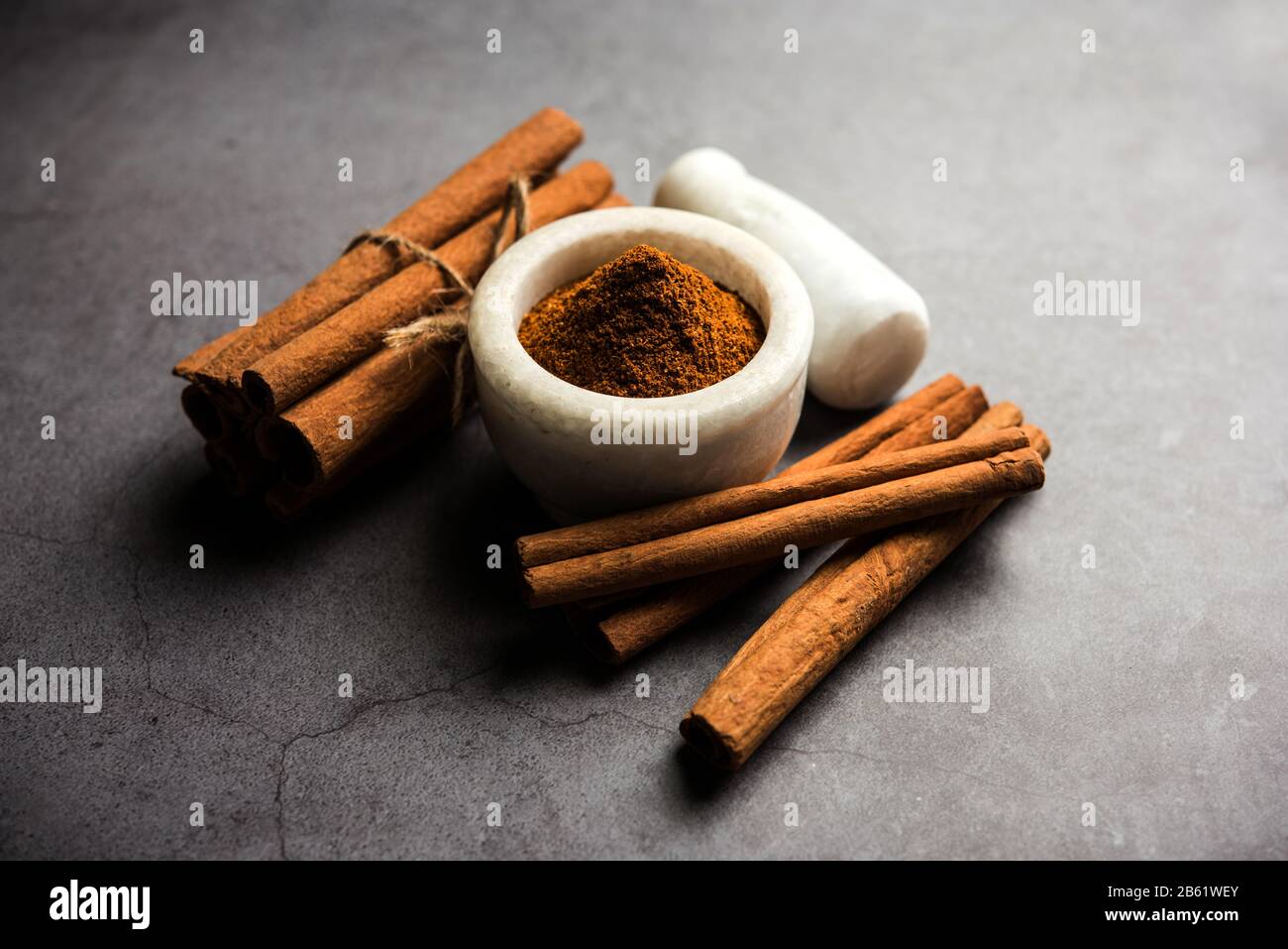 Powder cinnamon and sticks also known as Dalchini or Dalcheenee masala ...