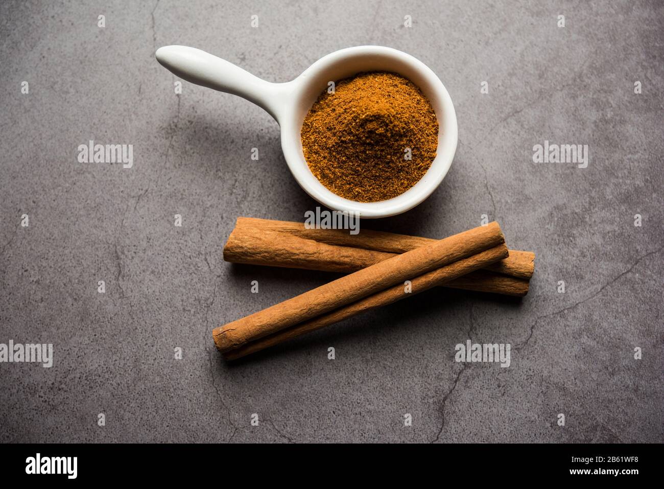 Powder cinnamon and sticks also known as Dalchini or Dalcheenee masala ...
