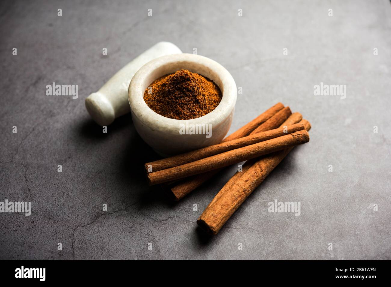 Powder cinnamon and sticks also known as Dalchini or Dalcheenee masala ...