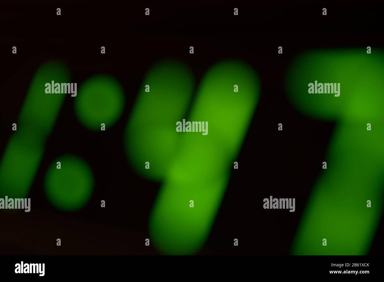 Glowing green clock hi-res stock photography and images - Alamy