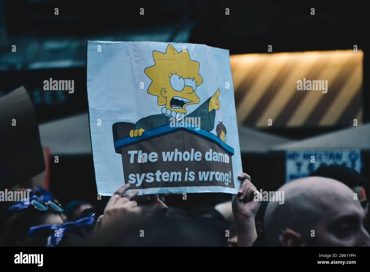 Poster in the 8M protest with Lisa Simpson Stock Photo - Alamy