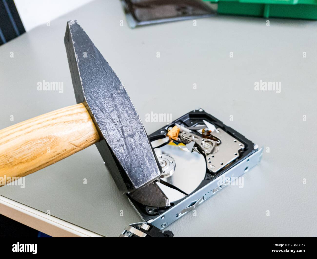 Destroying computer hard drive with a hammer Stock Photo - Alamy