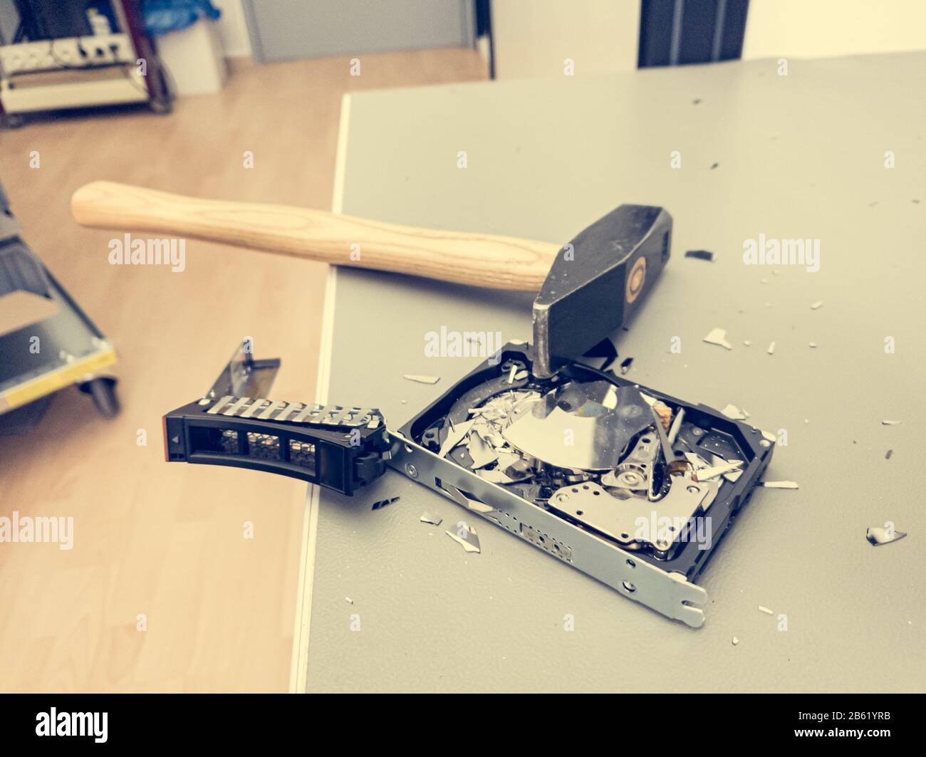 Destroying computer hard drive with a hammer Stock Photo - Alamy