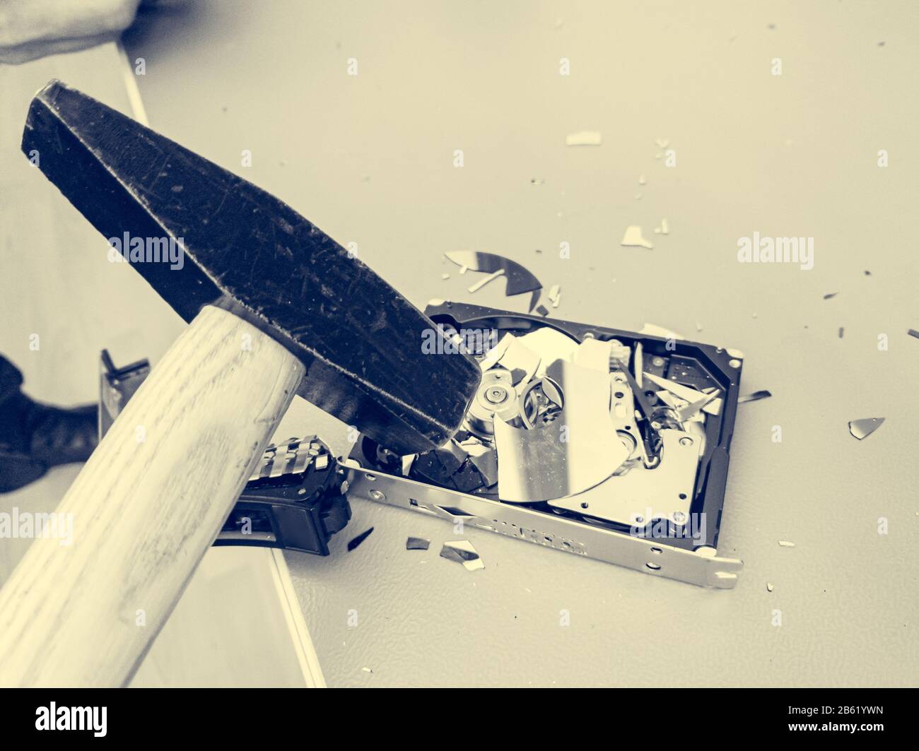 Destroying computer hard drive with a hammer Stock Photo - Alamy