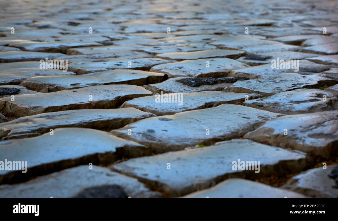 flush plane of a cobbled street with old stone tiles Stock Photo - Alamy