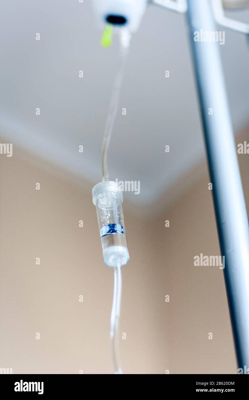 Close-up bottle of medicine on dropper system in the operating room ...