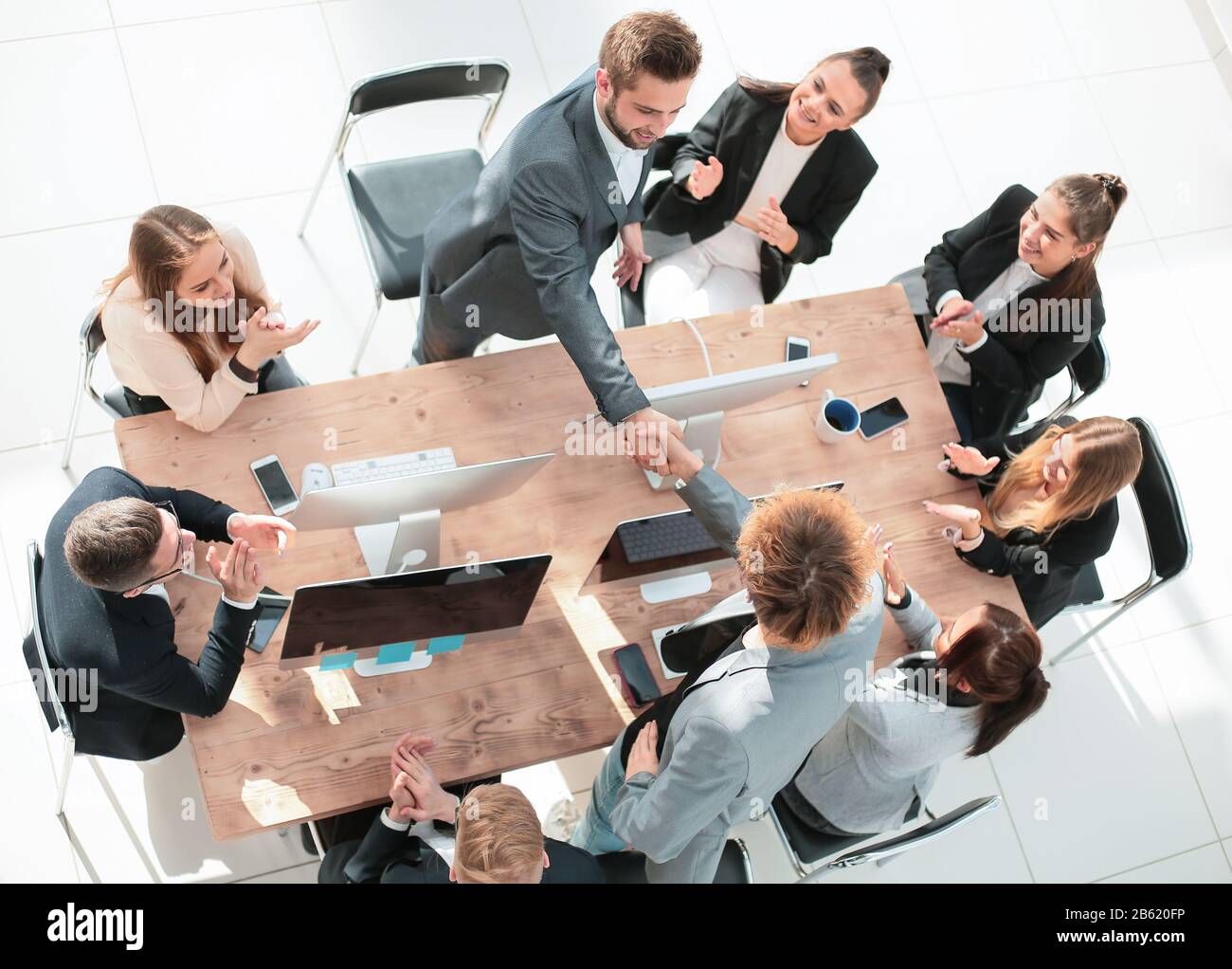 boss shaking hands with the employee during the working meeting Stock ...