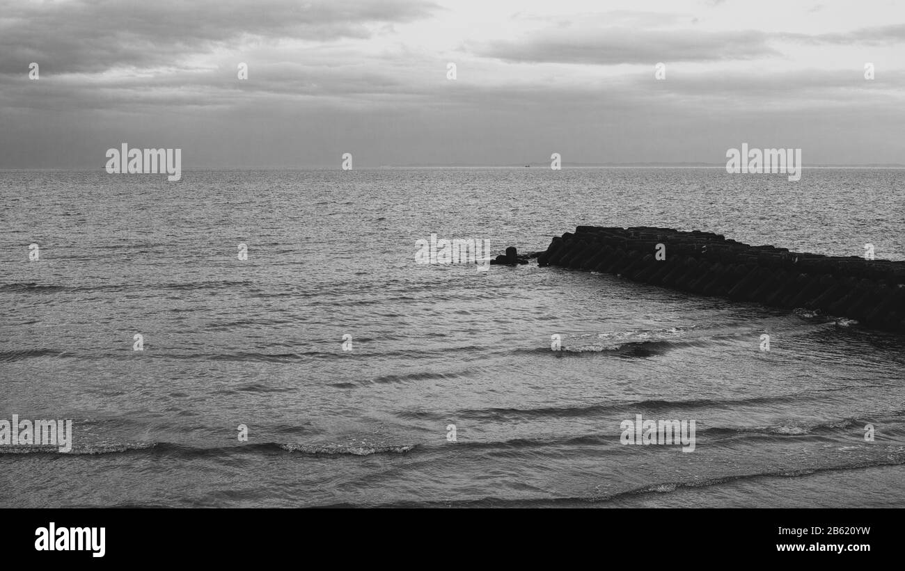 A rocky spurt of land jutting into the sea Stock Photo - Alamy