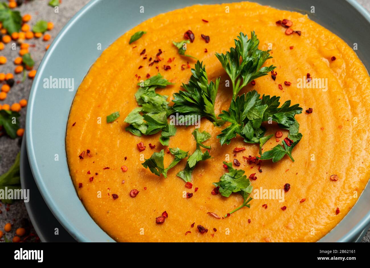 Indian Dhal spicy curry in bowl, spices, herbs, rustic grey wooden ...