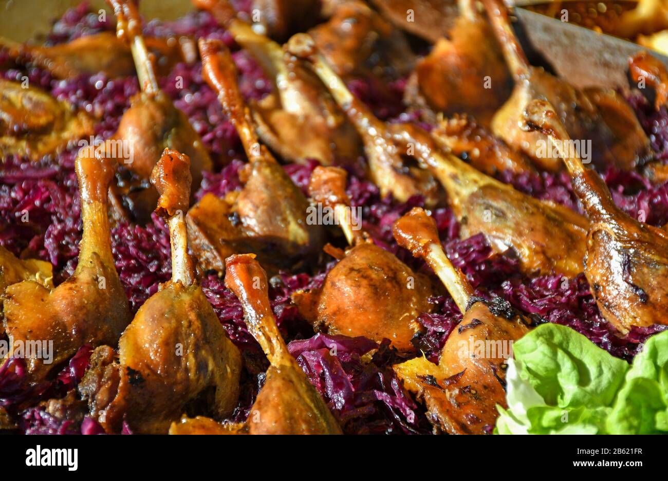 Goose leg roasting barbecue outdoor Stock Photo - Alamy