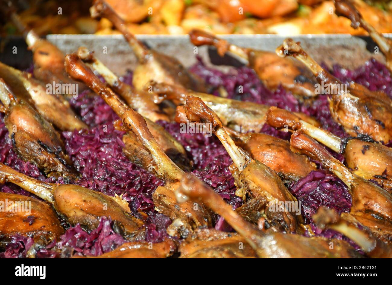 Goose leg roasting barbecue outdoor Stock Photo - Alamy