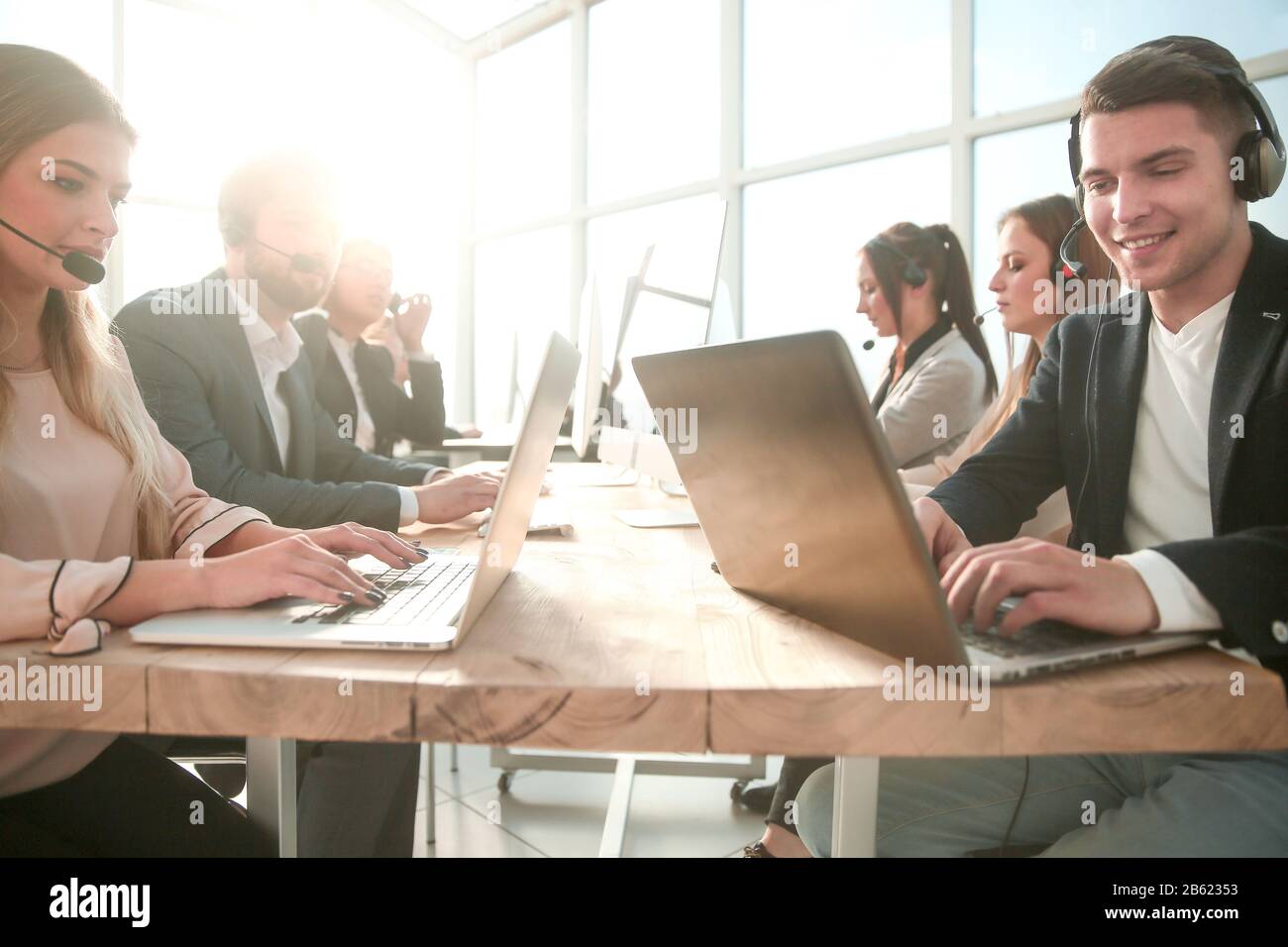 business center employees using computers in the workplace Stock Photo ...