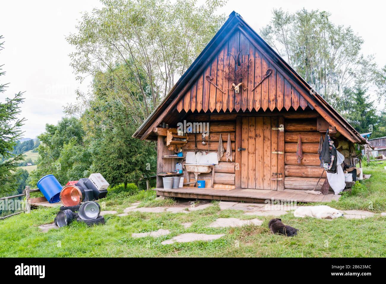 Wooden shepherd's hut in the mountains on a hillside Stock Photo - Alamy