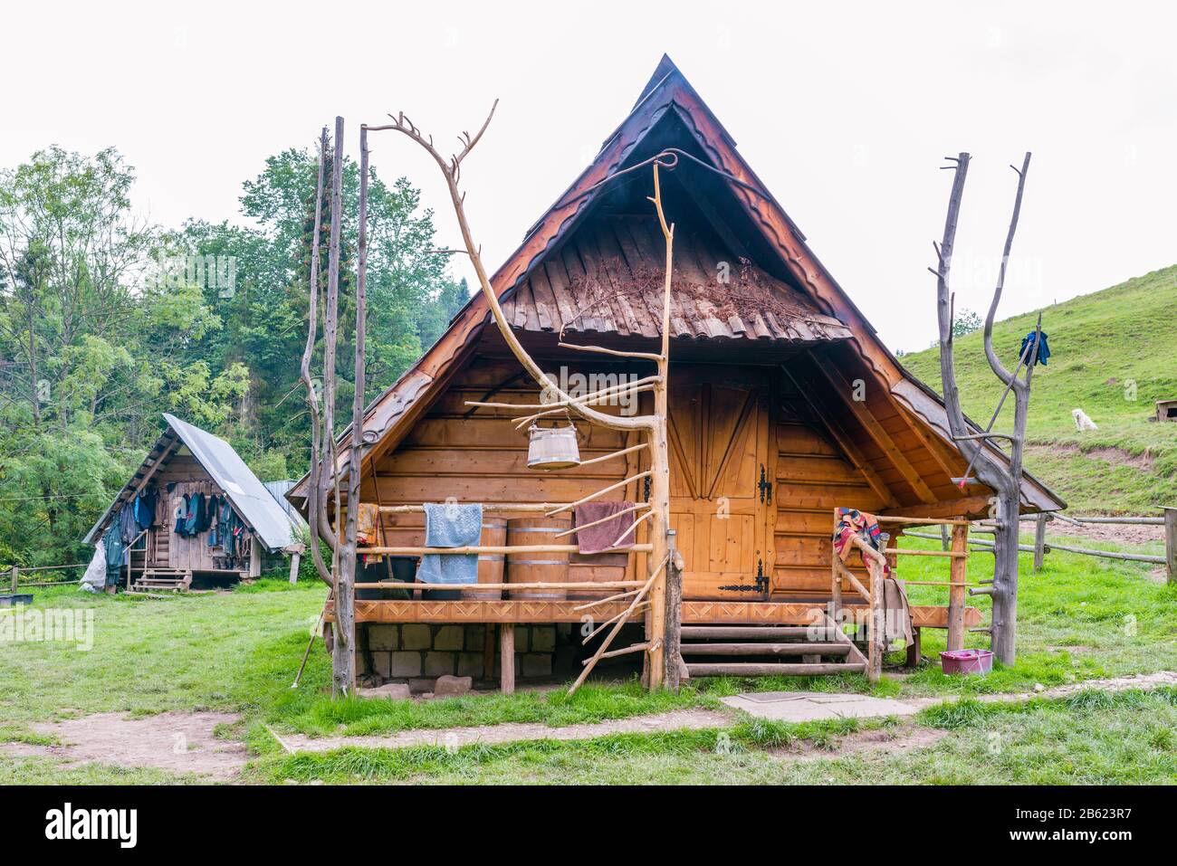 Wooden shepherd's hut in the mountains on a hillside Stock Photo - Alamy