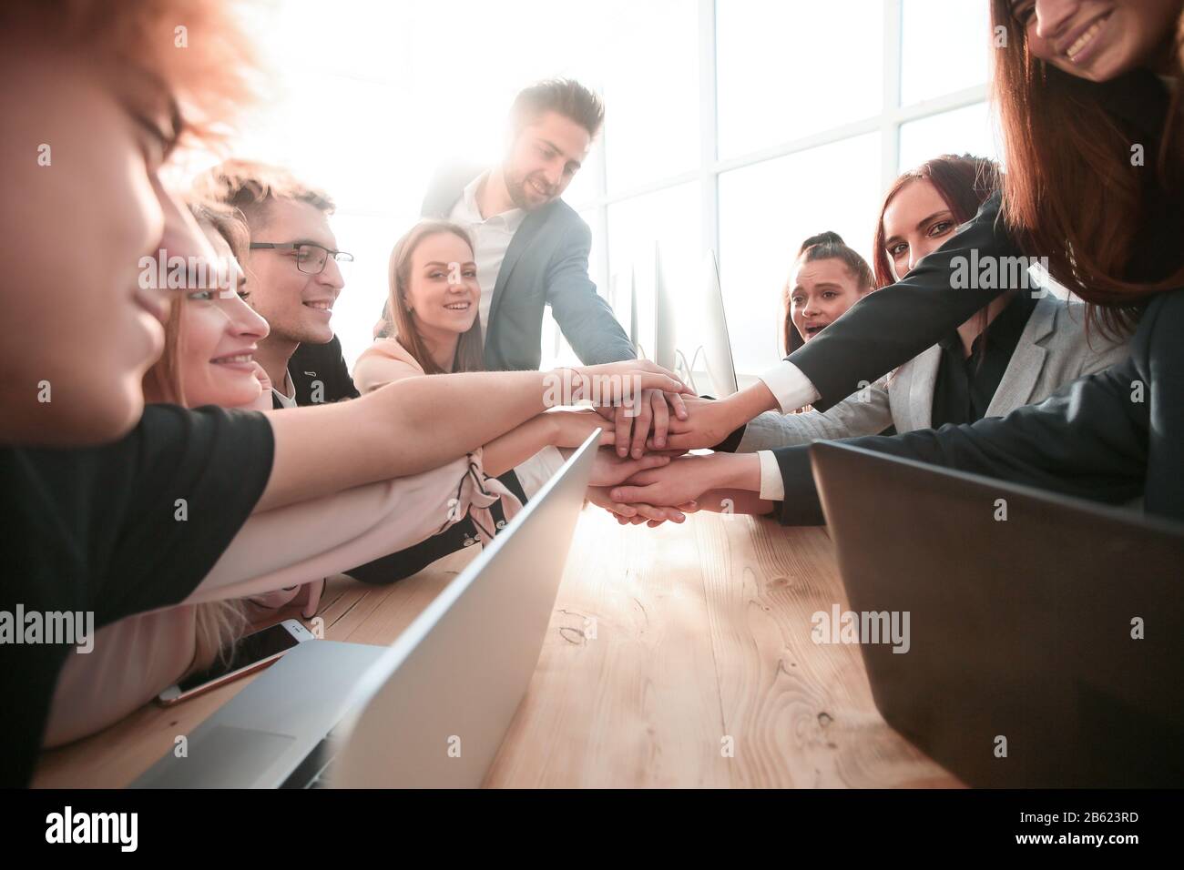 close up. a group of young employees showing their unity Stock Photo ...