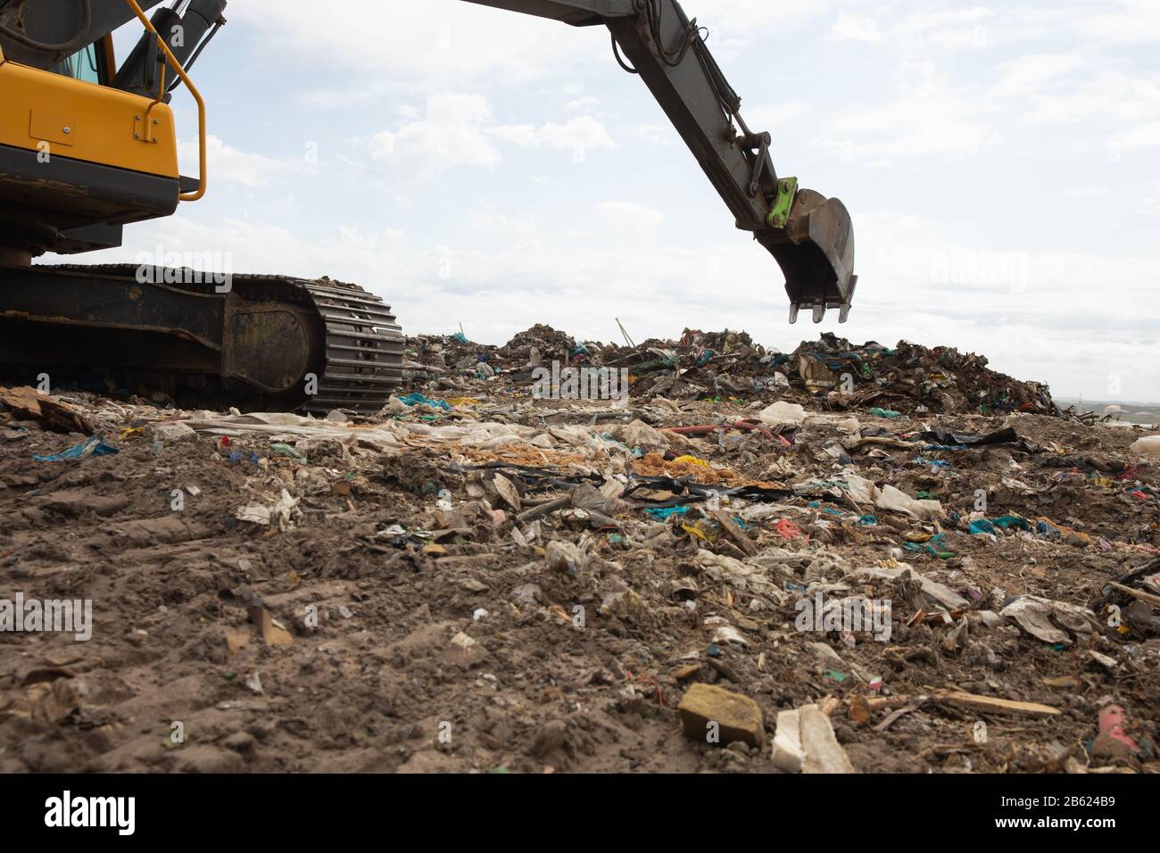 Plastic waste disposal with digger hi-res stock photography and images ...