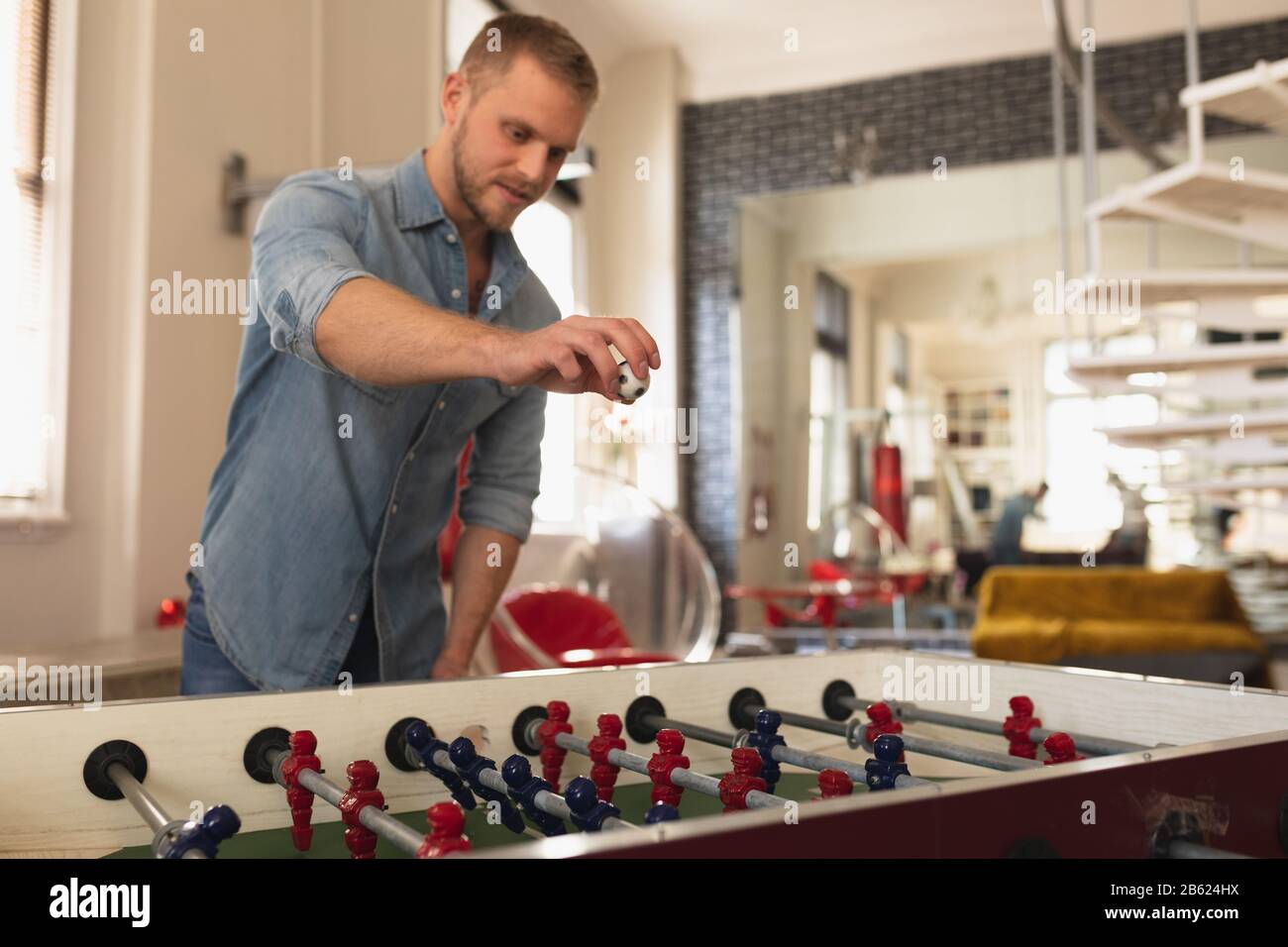 Table football playing hi-res stock photography and images - Alamy