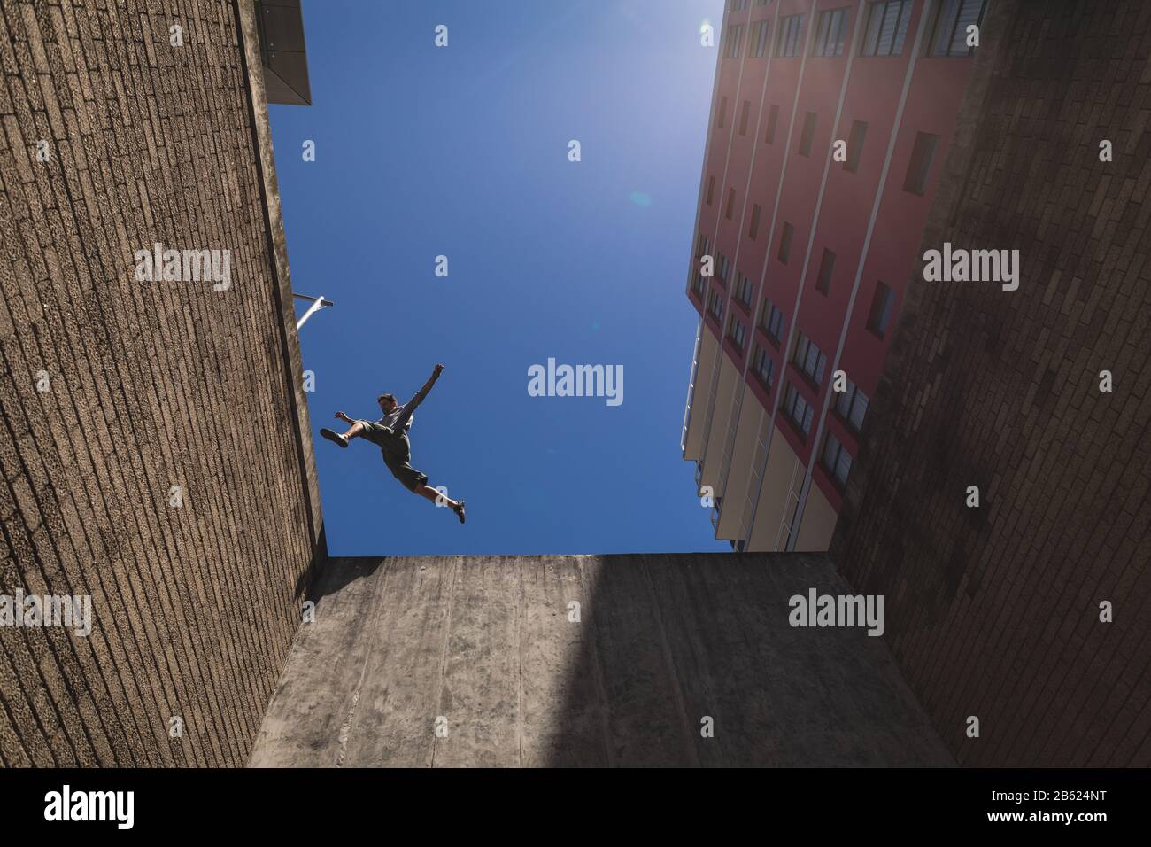 Jumping from building hi-res stock photography and images - Alamy