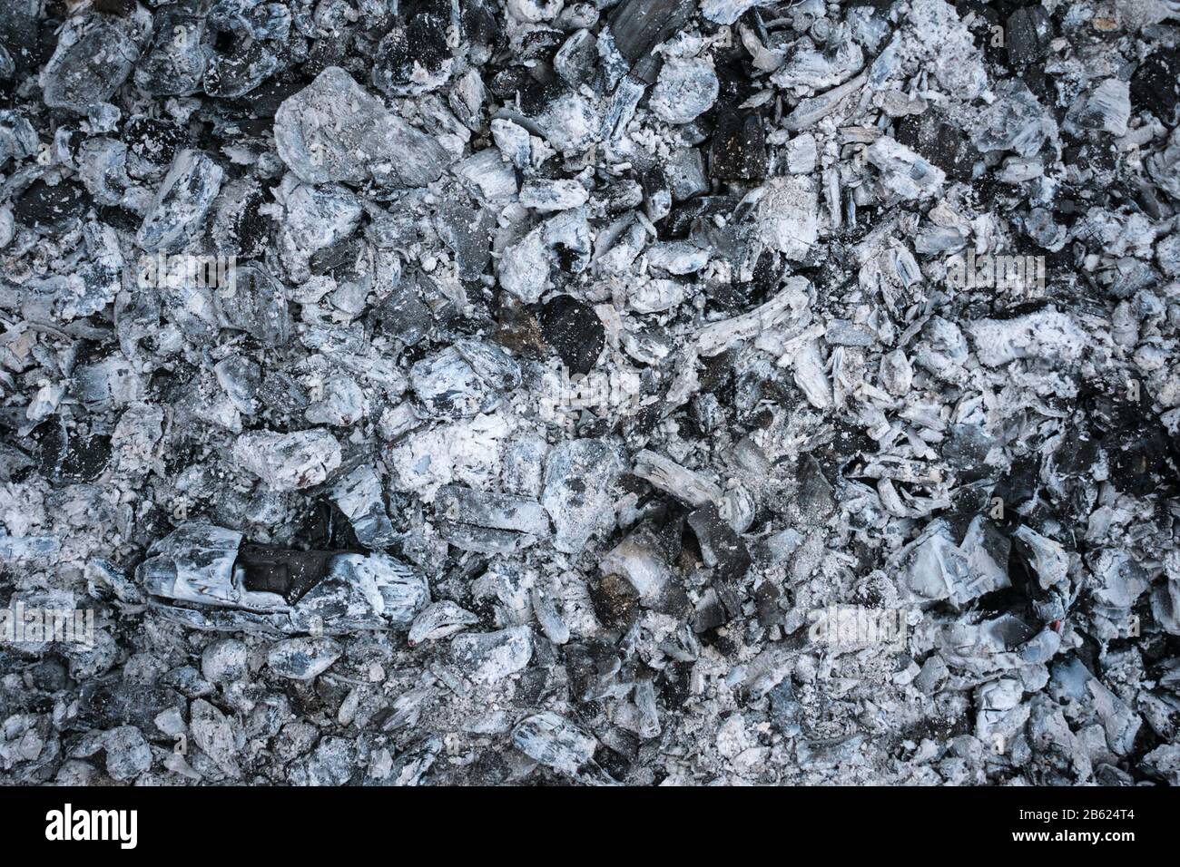 Coals and ashes in an extinct fire. Natural background Stock Photo - Alamy