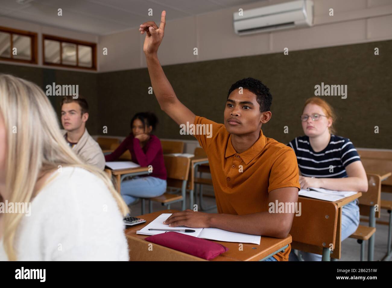 High School Student Raising Hand