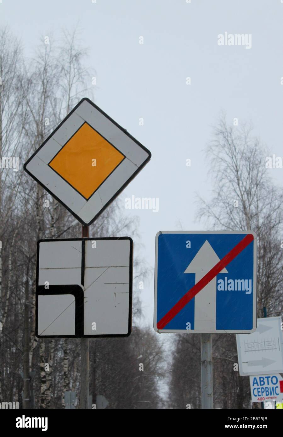 Road signs main road, end of one-way traffic, turn, crossed out arrow ...