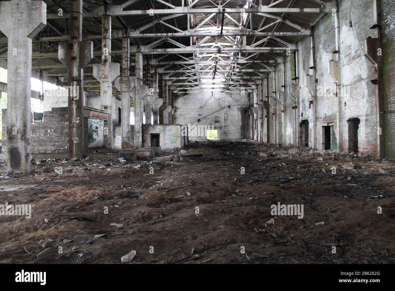 View inside an abandoned dilapidated industrial building with large ...