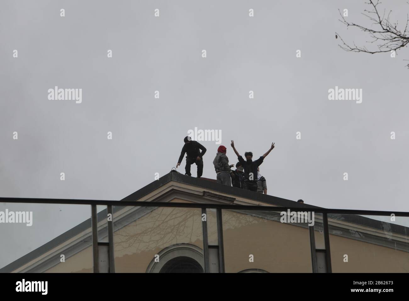 Milan, Italy. 09th Mar, 2020. Inmates stage a protest on a rooftop of a ...