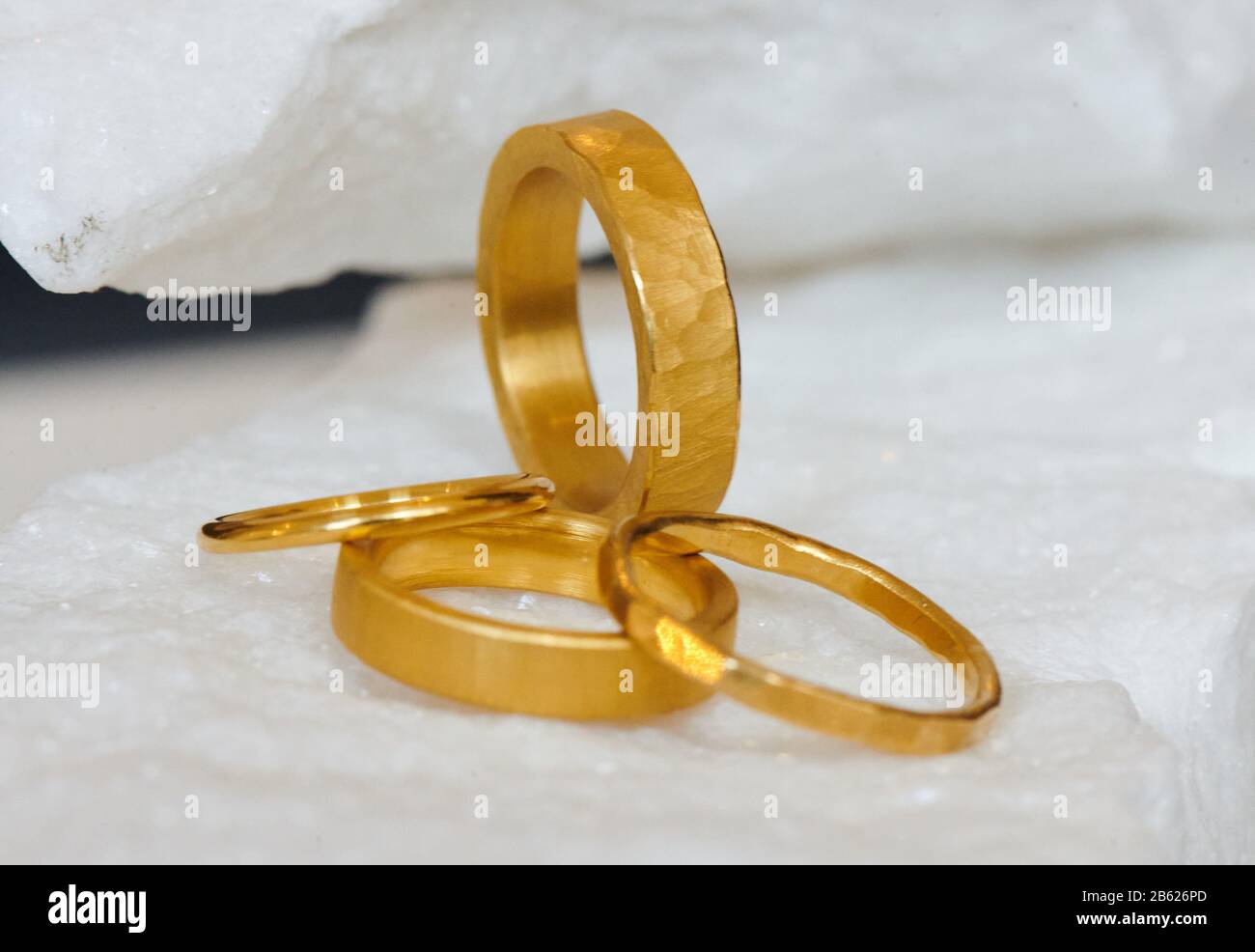 Four gold rings hi-res stock photography and images - Alamy