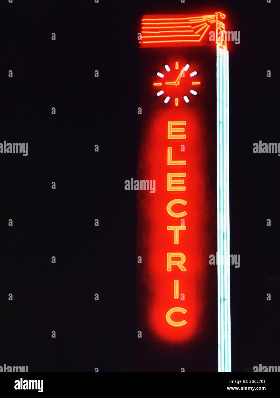 1956 Dallas - Neon sign featuring the word "Electric" with a clock on ...