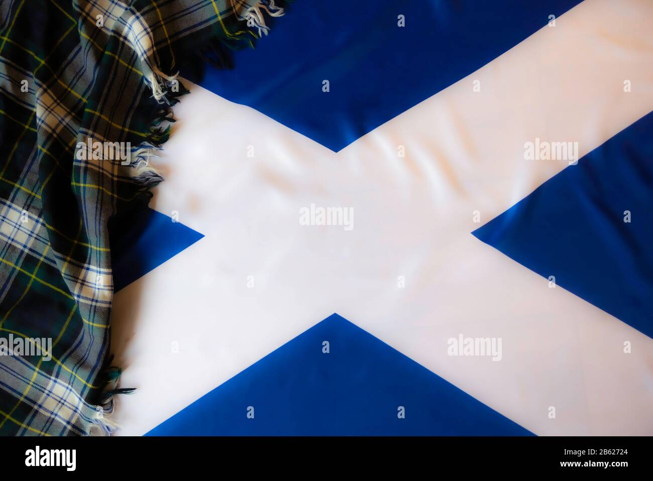 Scottish flag with kilt and tartan colours Stock Photo - Alamy