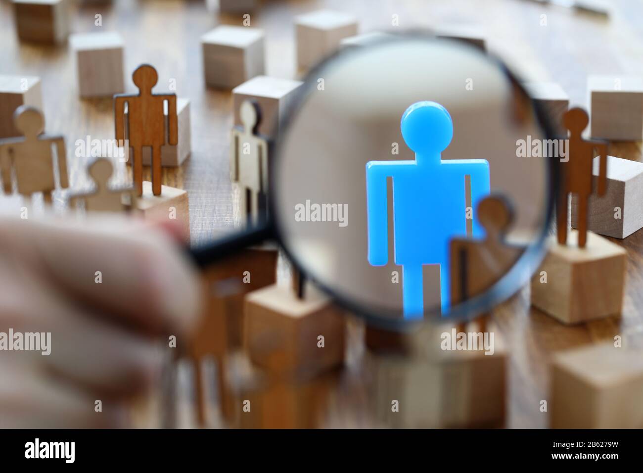 Searching for missing person in crowd of toy human figures with ...