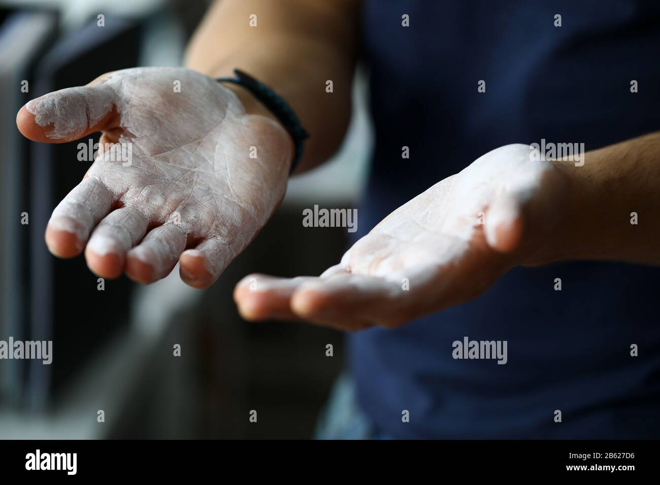Male hands smeared with magnesium powder ready to workout Stock Photo ...