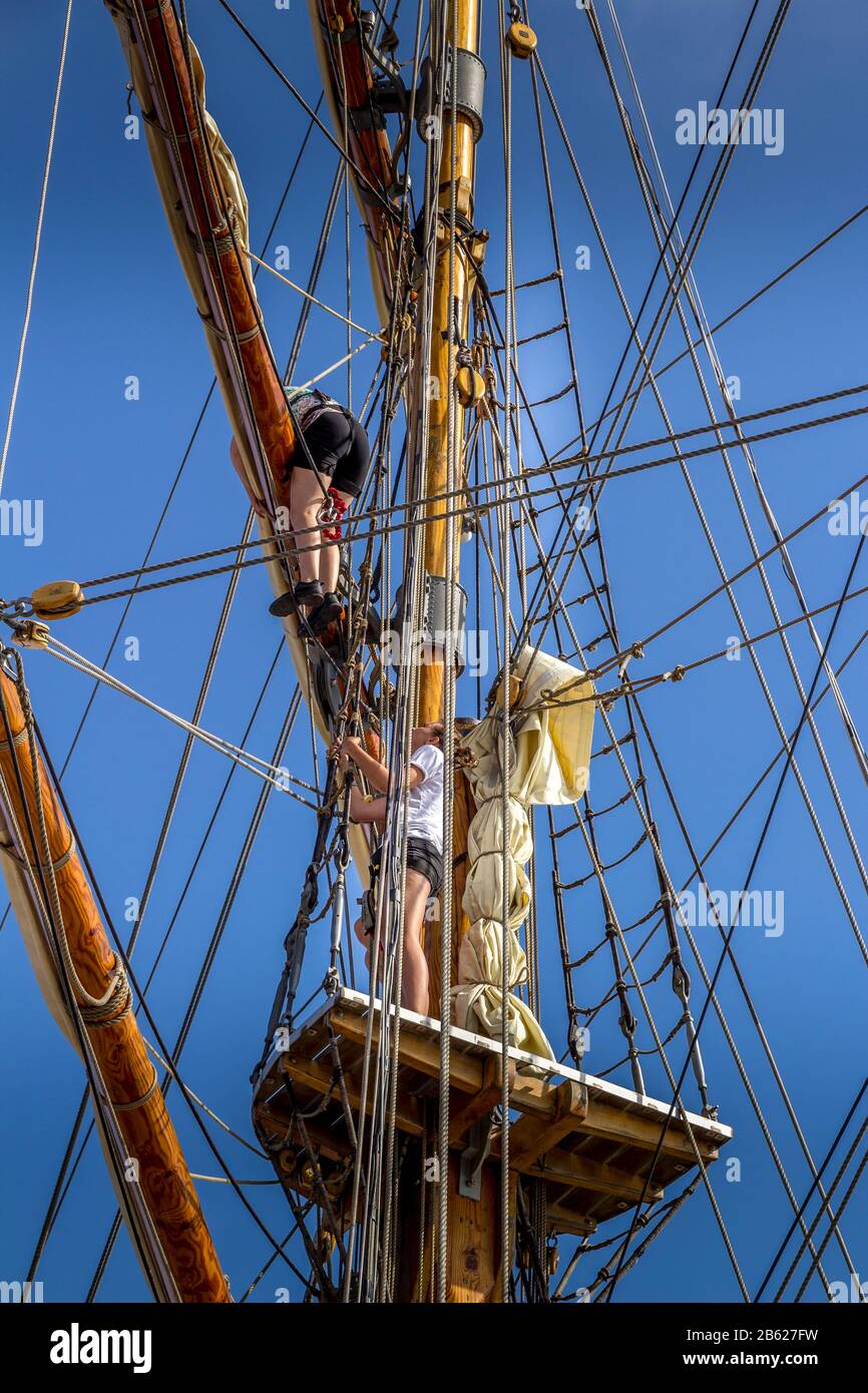 Esbjerg, Denmark - 02 August 2014: Sailors at the top of the mast to ...