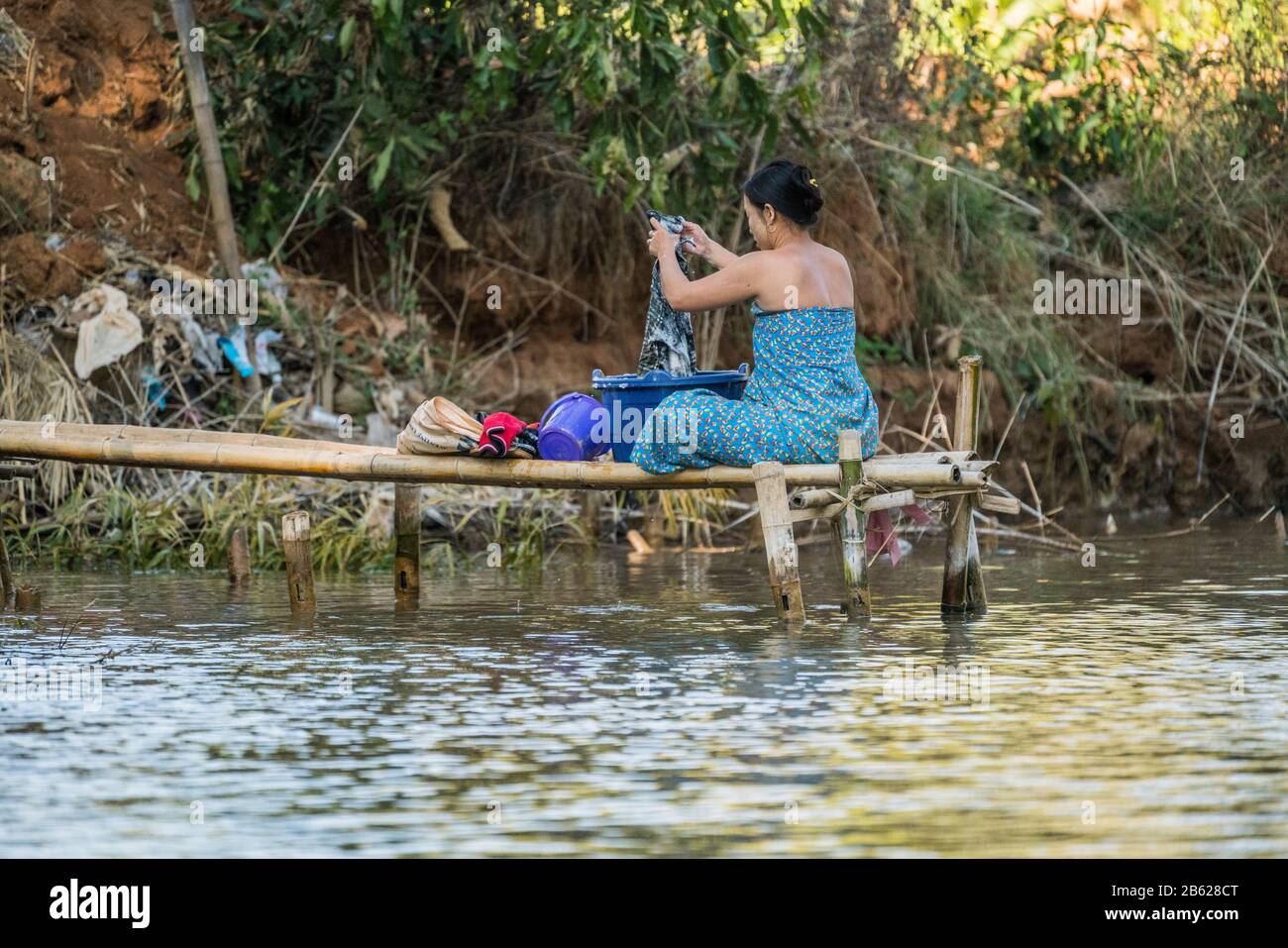 Local woman laundry clothes in the river, Inle lake, Myanmar, Asia ...