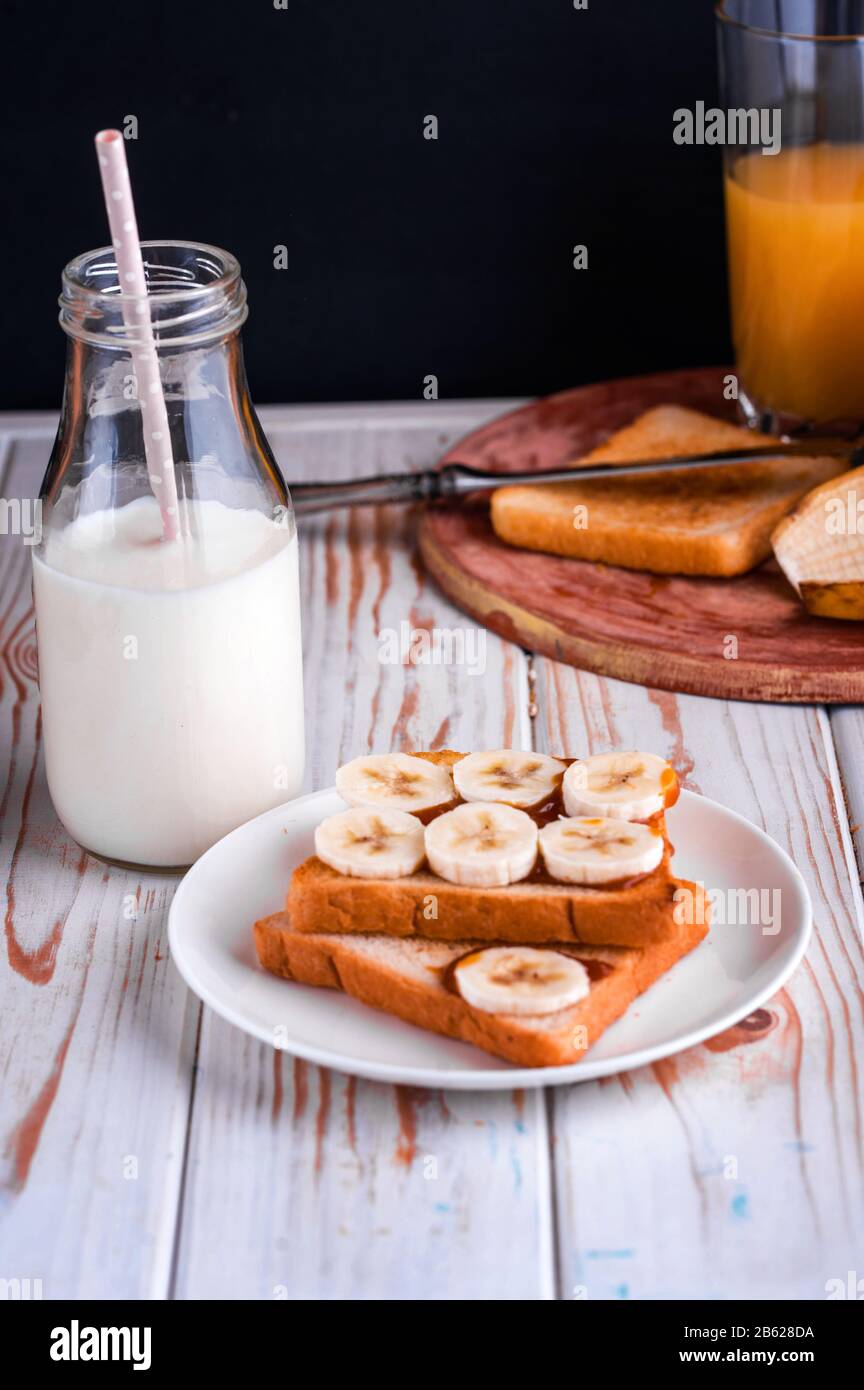 Fresh toast with salted caramel and banana. Delicious breakfast with ...