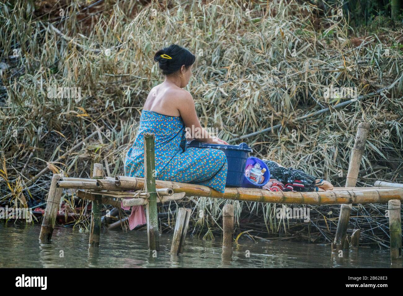 Local woman laundry clothes in the river, Inle lake, Myanmar, Asia ...
