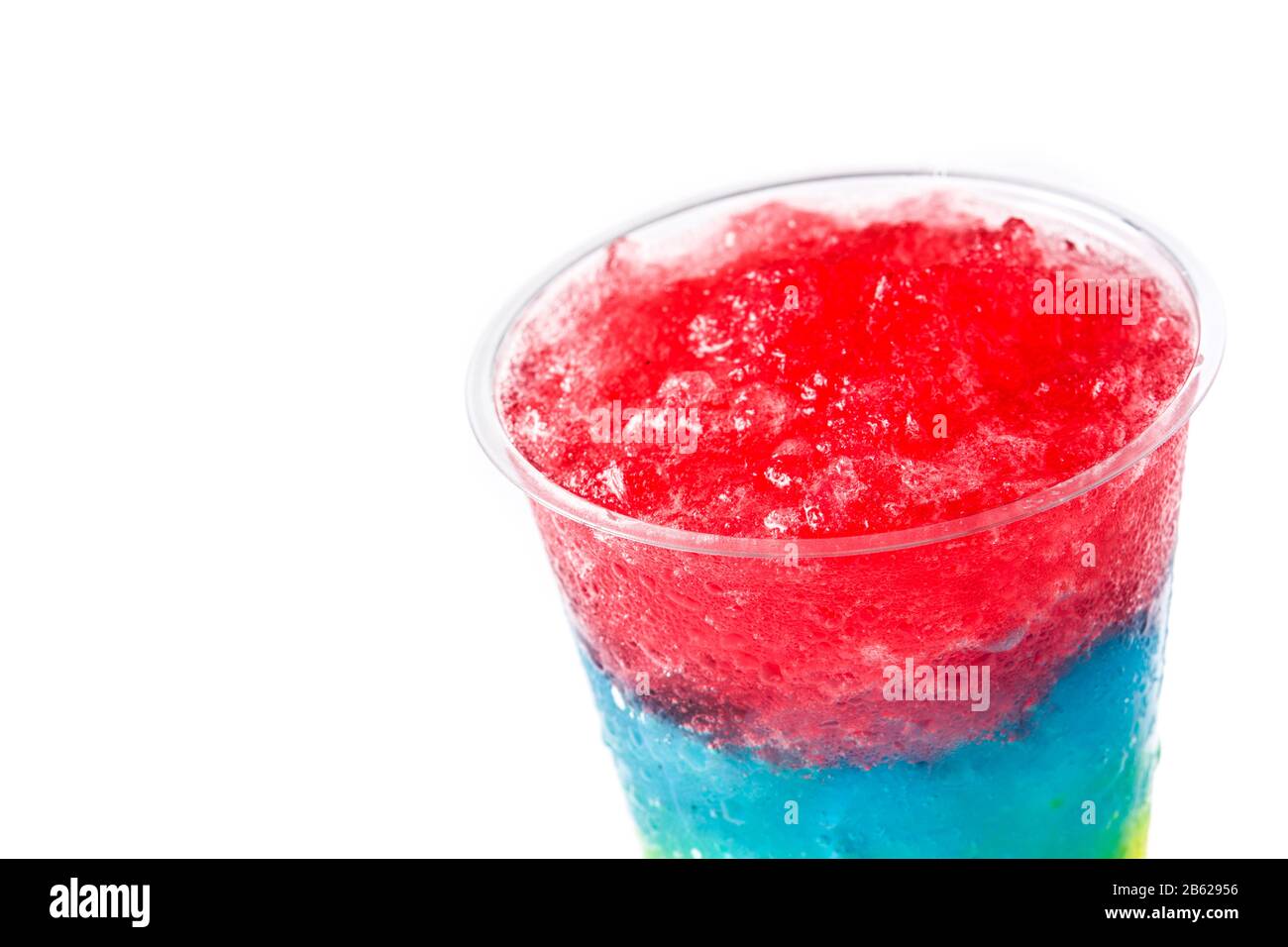 Colorful slushie of differents flavors with straw in plastic cup ...