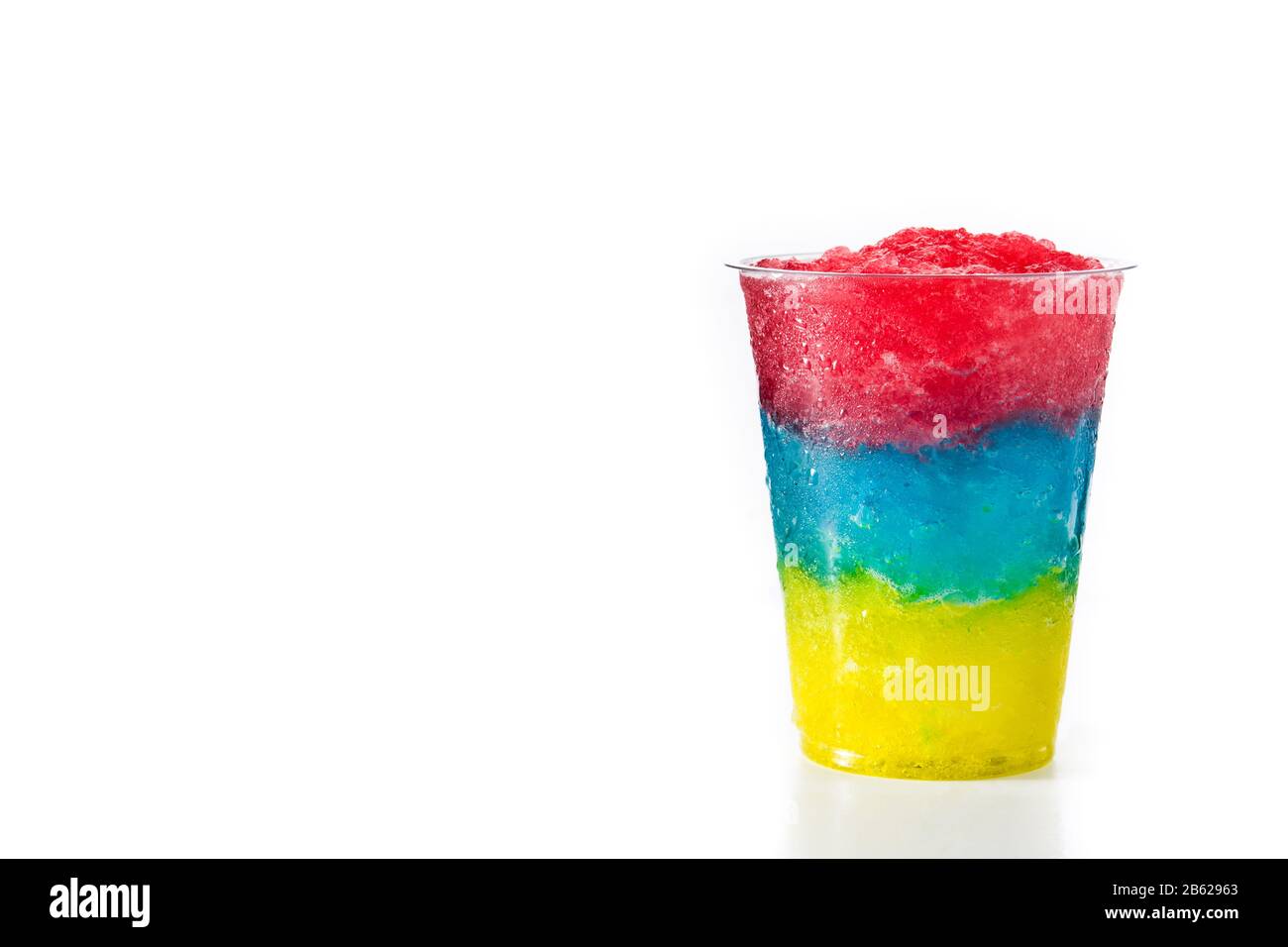 Colorful slushie of differents flavors with straw in plastic cup ...