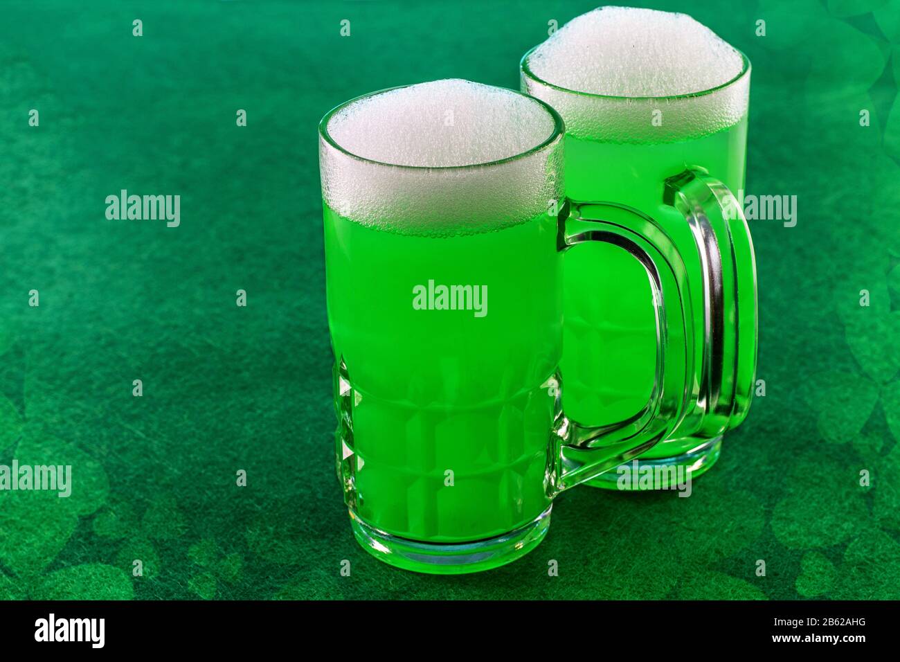 St. Patrick's Day green beer on the green background closeup isolated ...