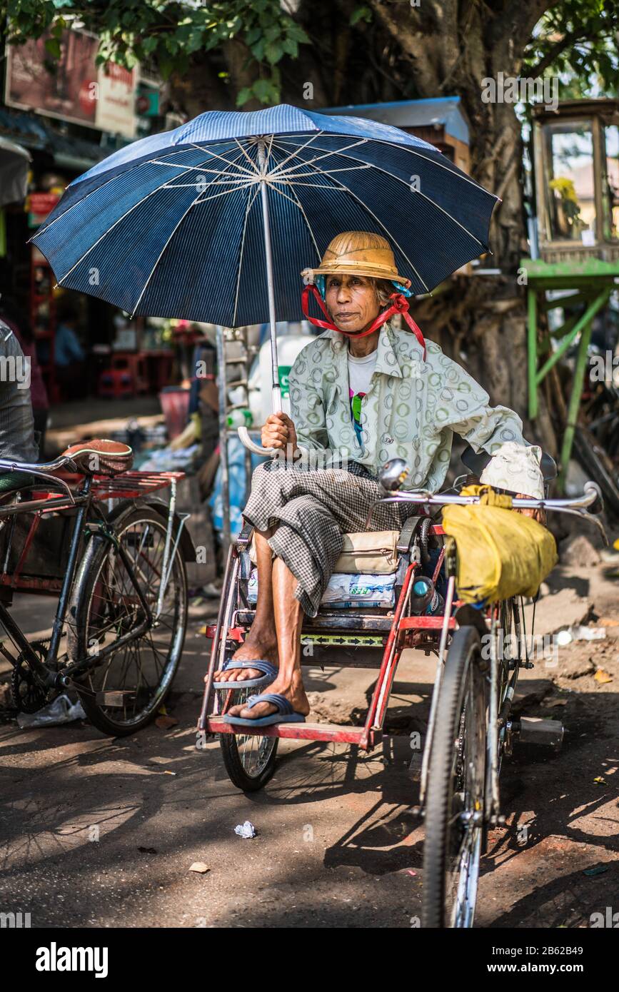Rickshaw rider in the street, Yangon, Myanmar, Asia Stock Photo - Alamy