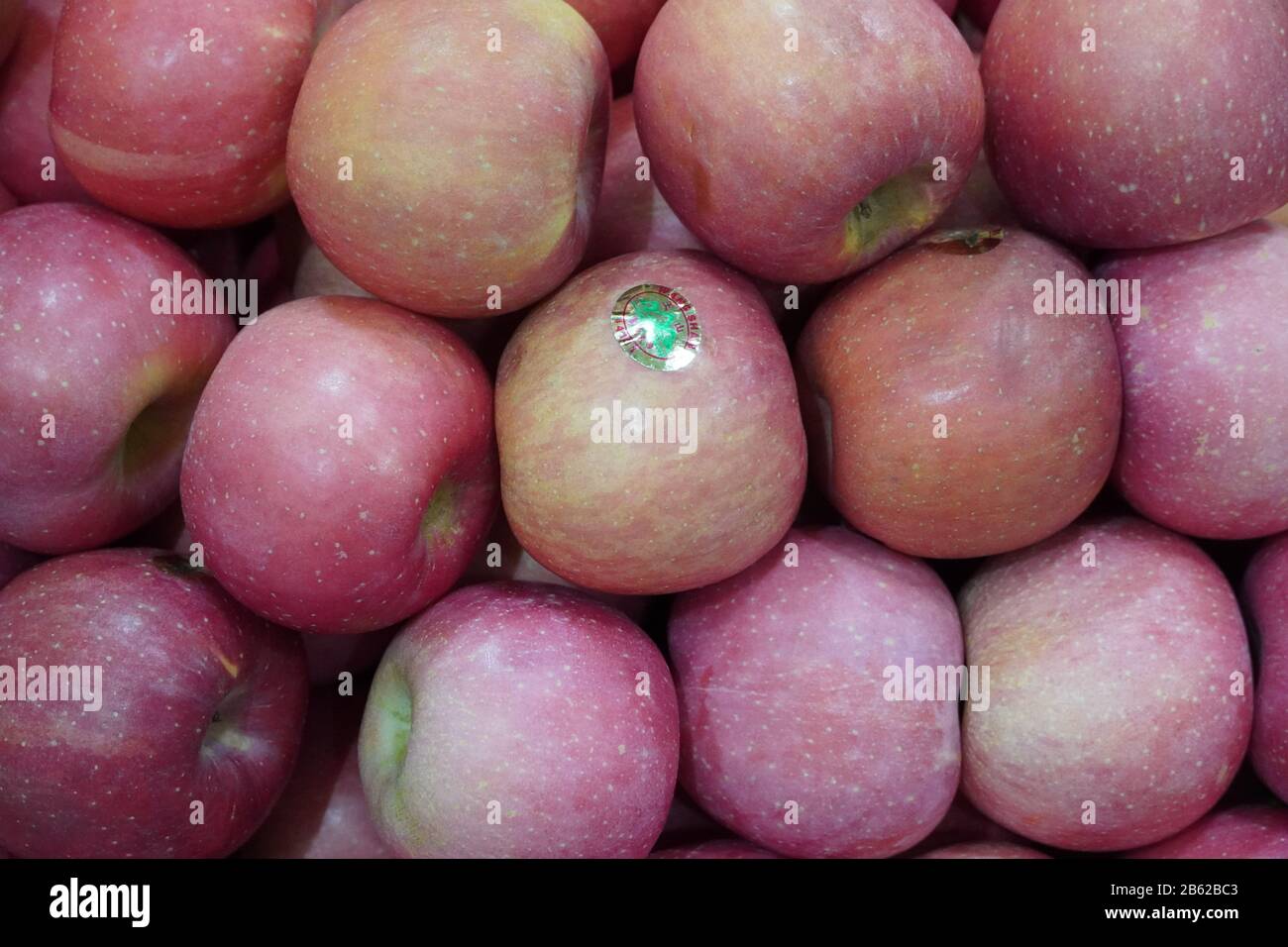 Dubai UAE - November 2019: Bunch of pink apples on boxes in supermarket ...