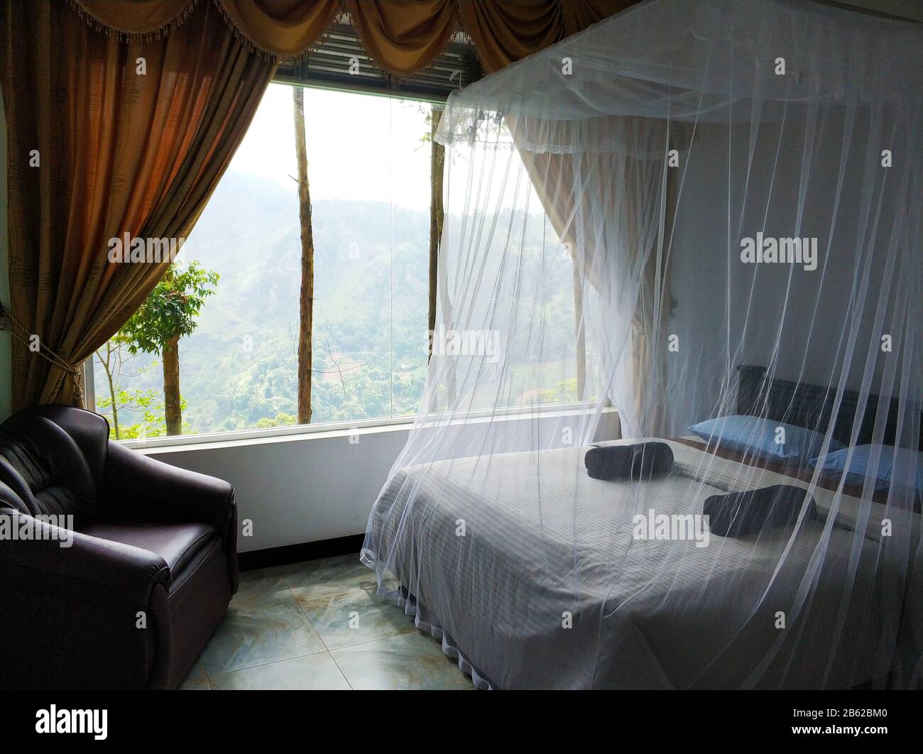 Hotel interior with large panoramic window and view of Mount Stock ...