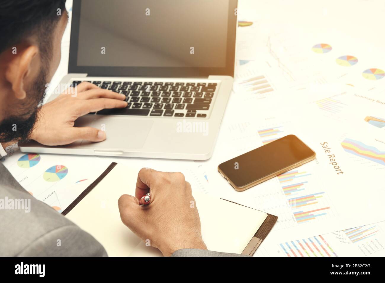 business man sitting writing text note black cover on graph diagram ...