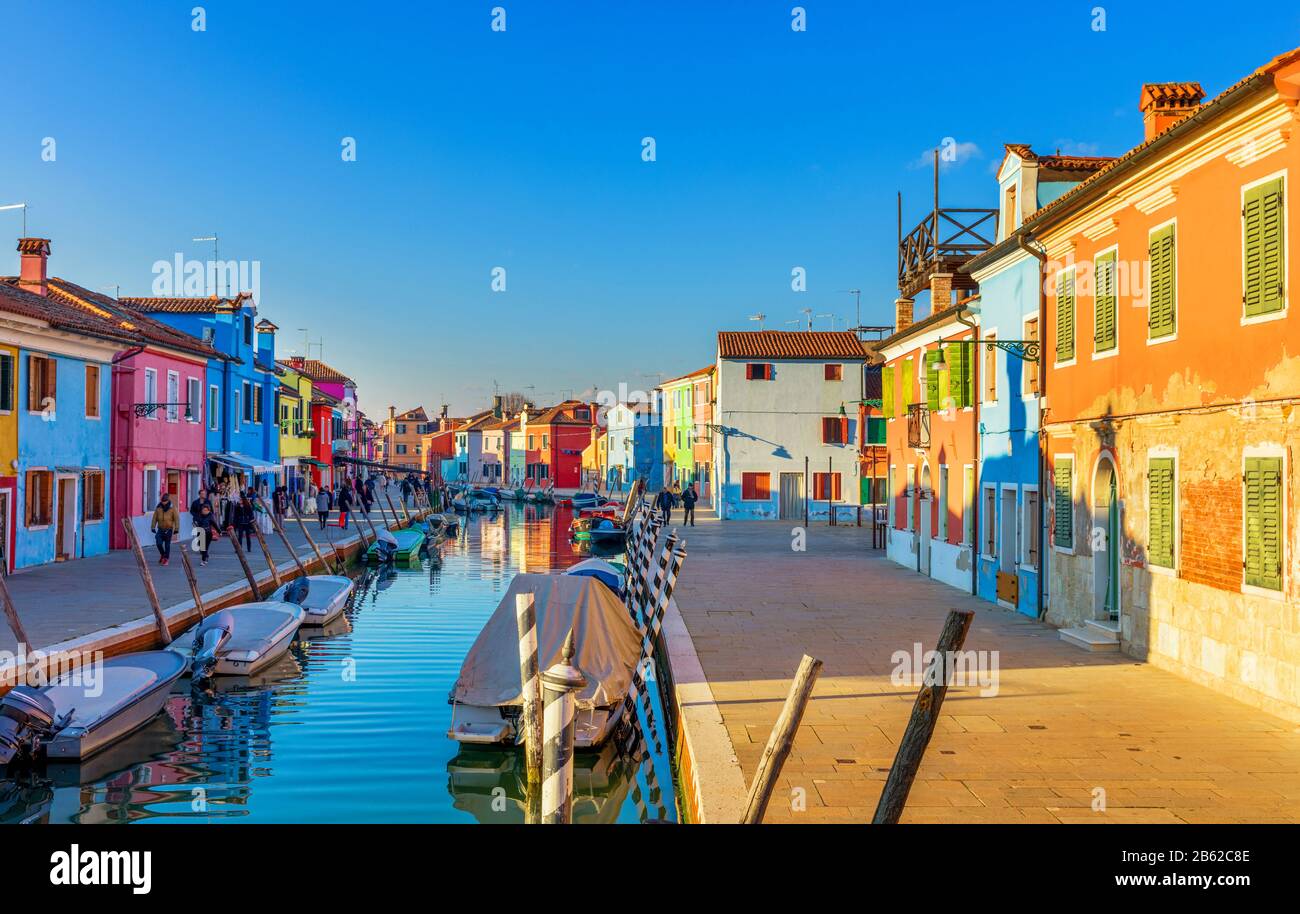 Beautiful view of the canals of Burano with boats and beautiful ...