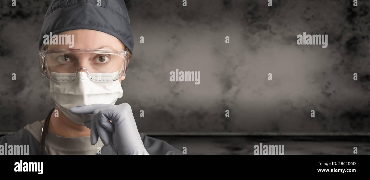 Female Doctor or Nurse Wearing Scrubs, Protective Face Mask and Goggles ...